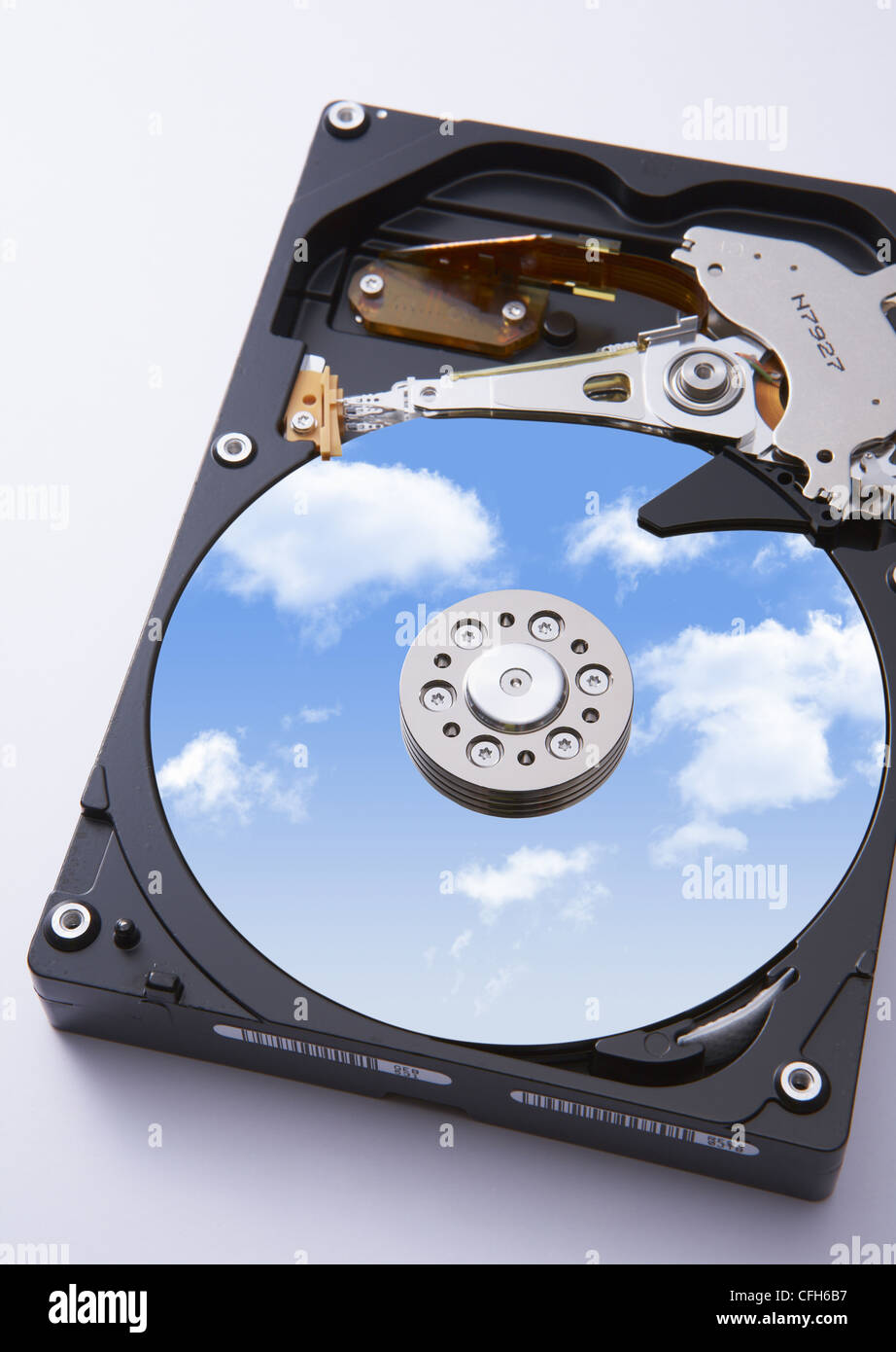 Hard disk reflecting blue sky Stock Photo - Alamy