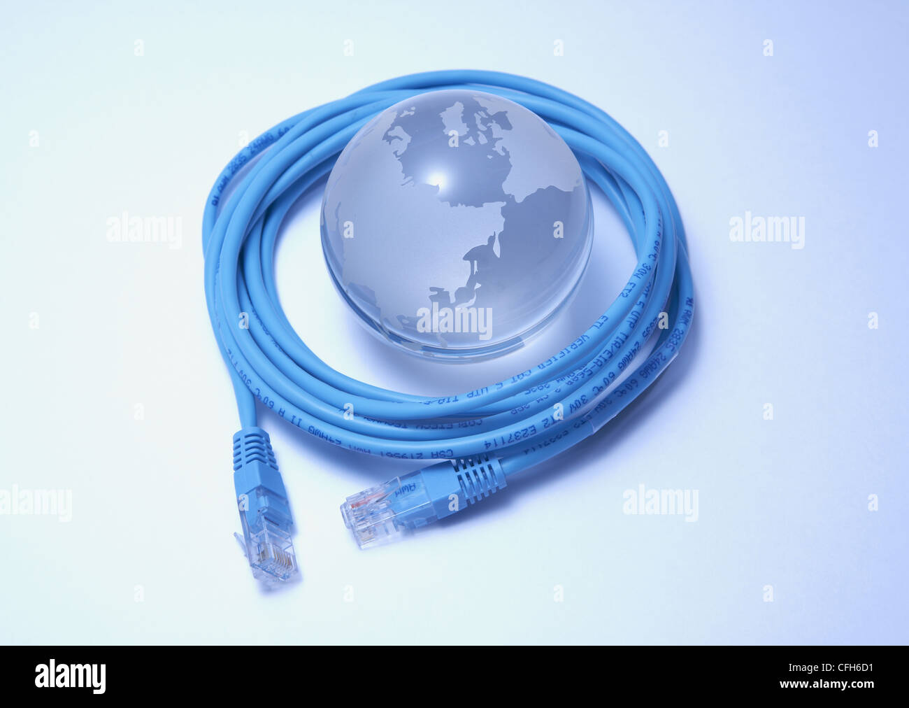 Glass globe surrounded with LAN cable Stock Photo - Alamy