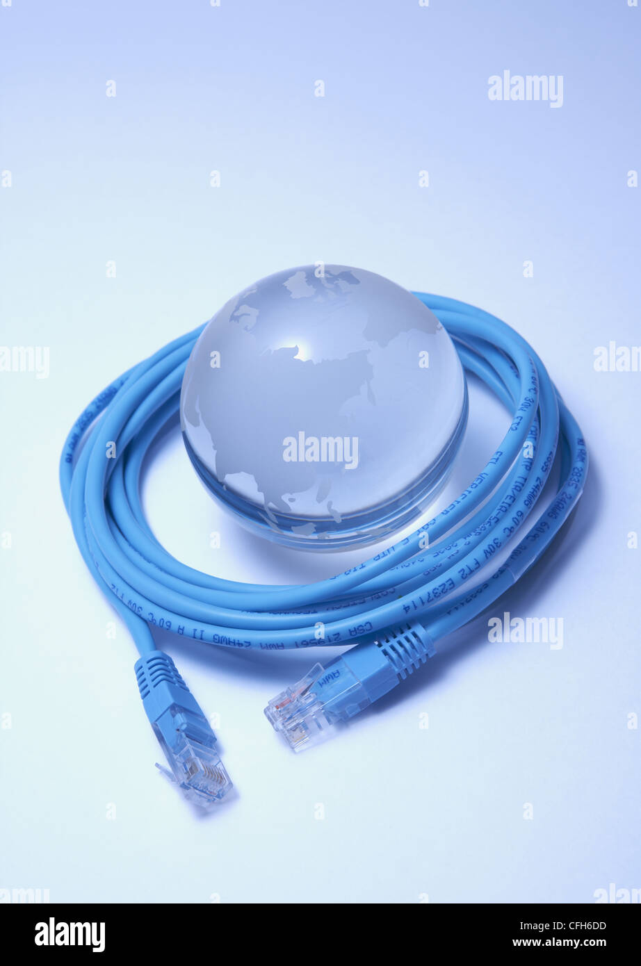 Glass globe surrounded with LAN cable Stock Photo - Alamy