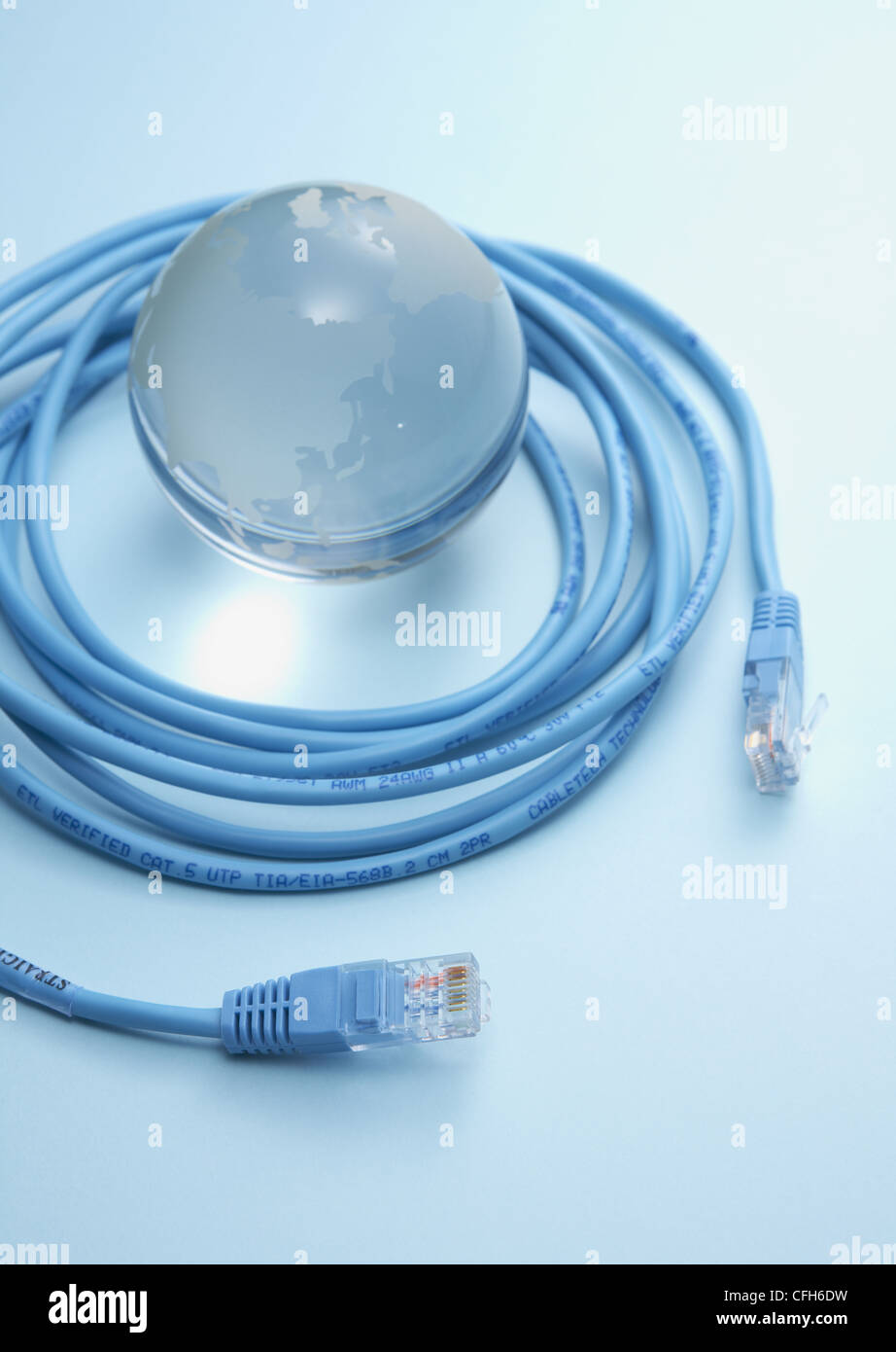 Glass globe surrounded with LAN cable Stock Photo - Alamy