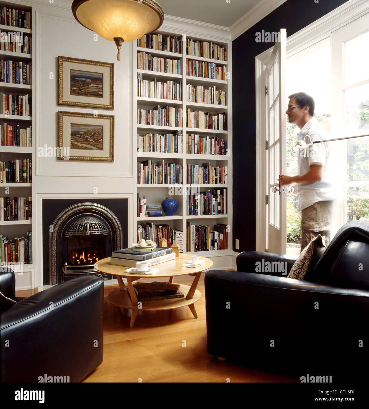 Man Entering Home Library Stock Photo - Alamy