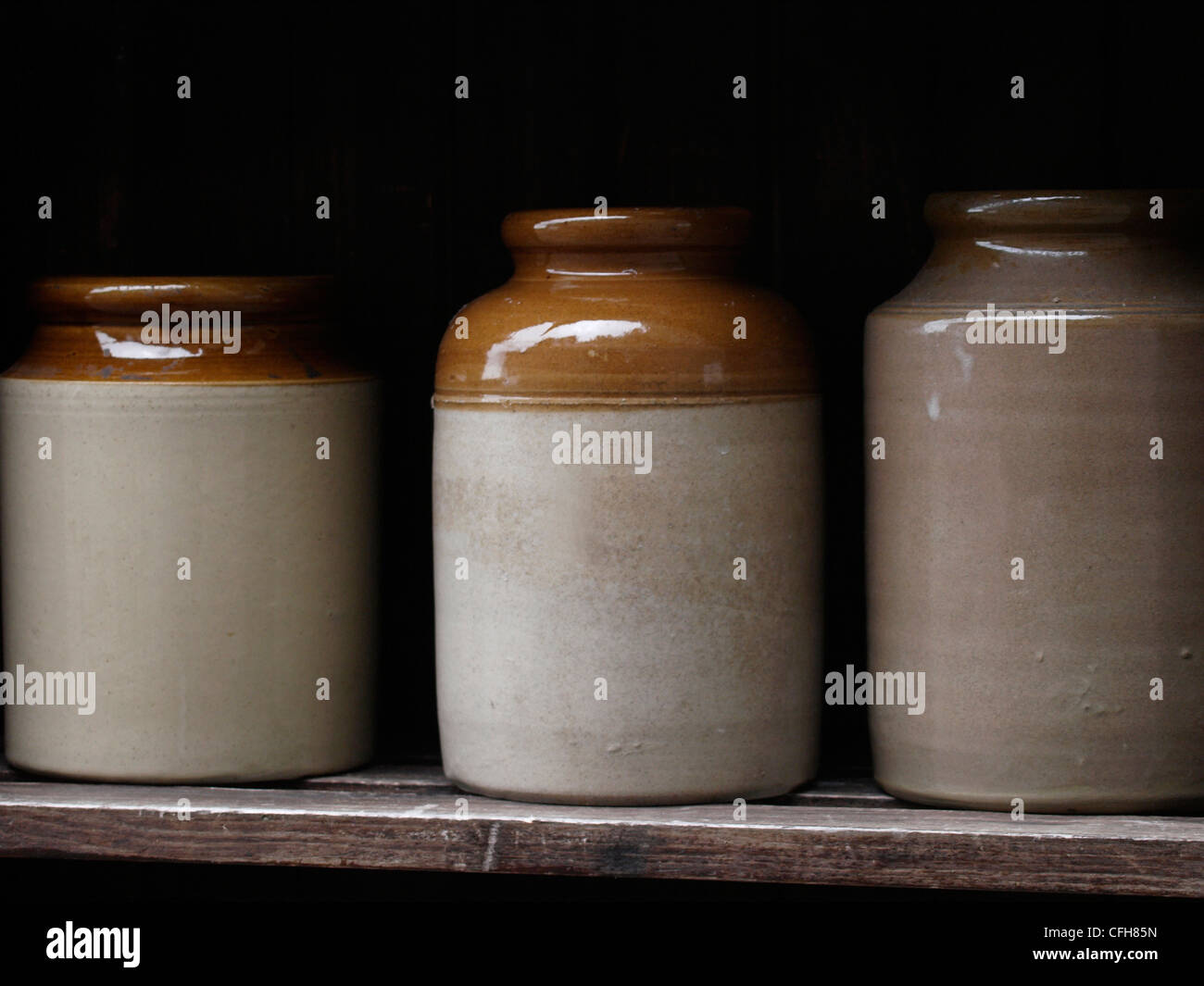 Three old stone jars Stock Photo - Alamy