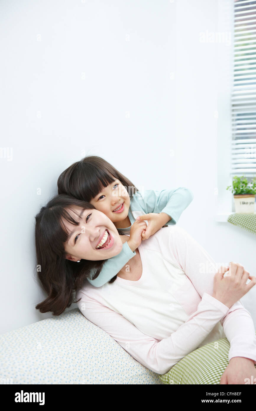 The girl hugging the woman from back Stock Photo - Alamy