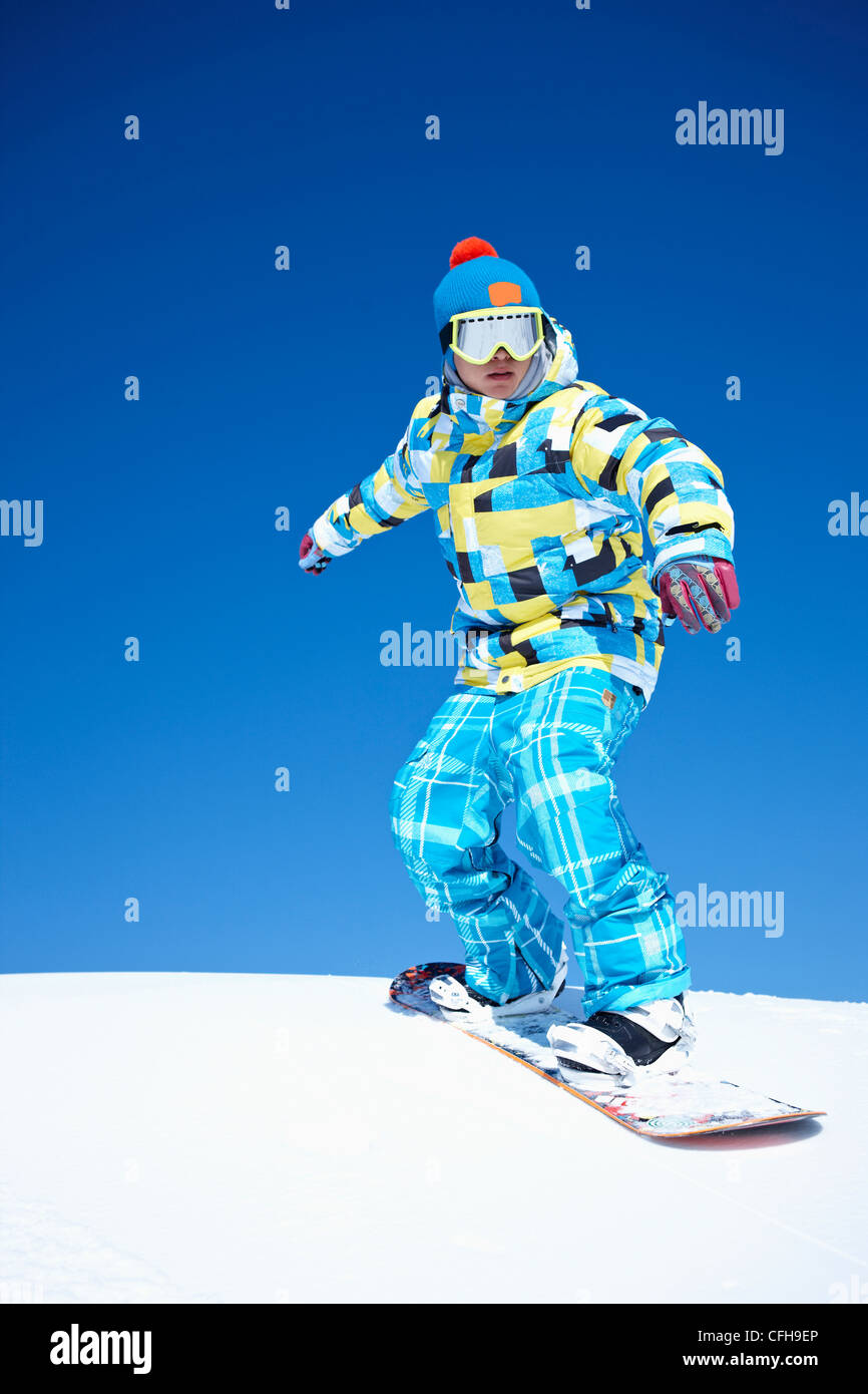 The man snowboarding on the slope Stock Photo - Alamy