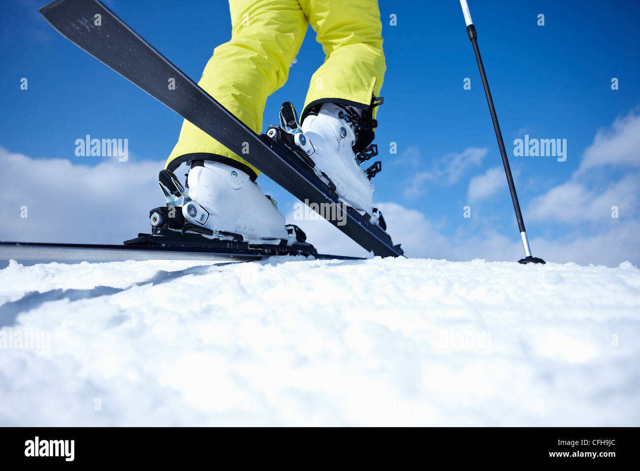The feet of man wearing the ski board Stock Photo - Alamy