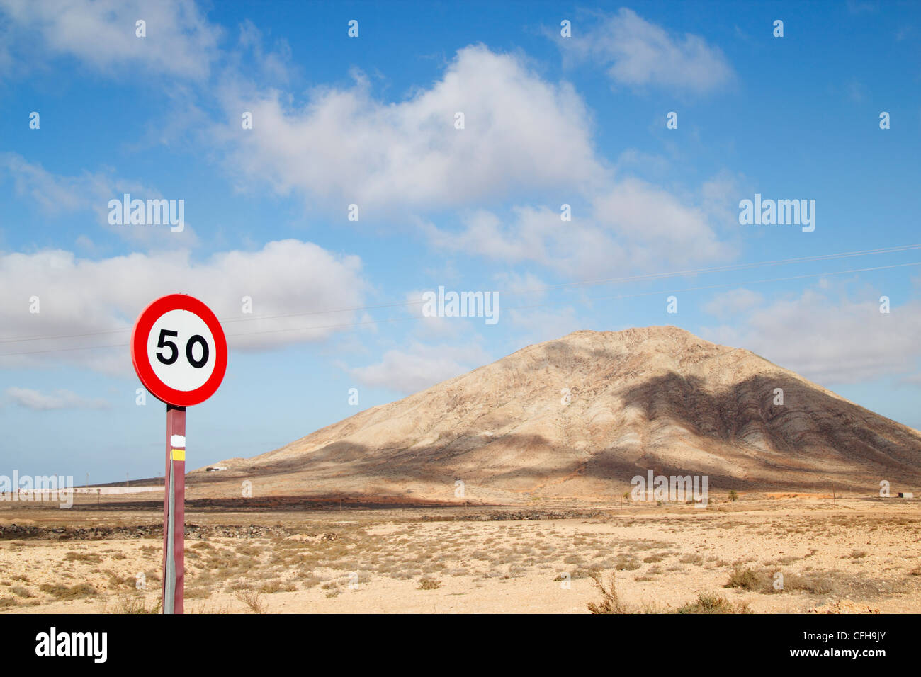 White and yellow footpath marking on roadsign near Tindaya mountain on ...