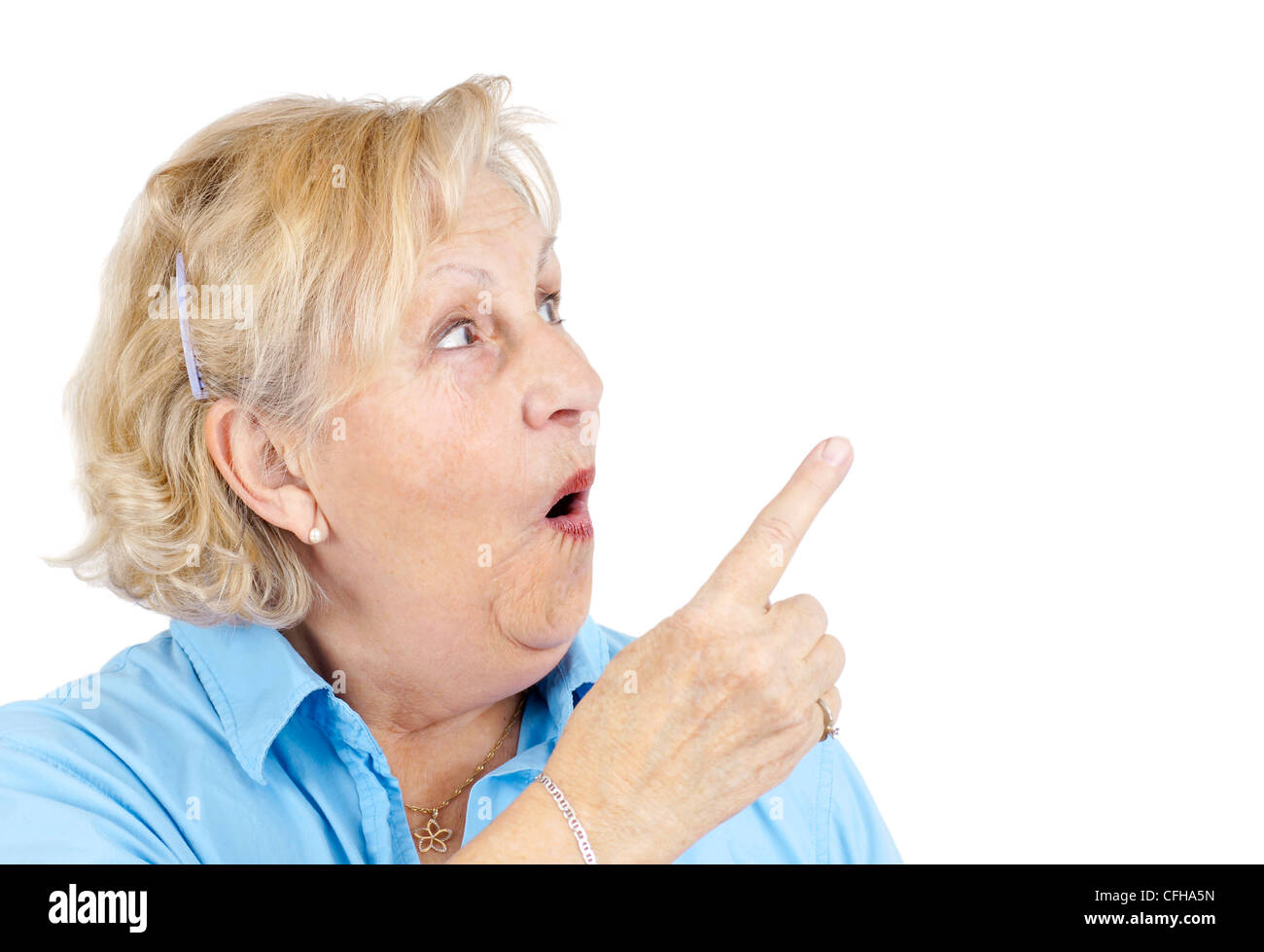 Funny senior woman with surprised face or in shock pointing with her ...
