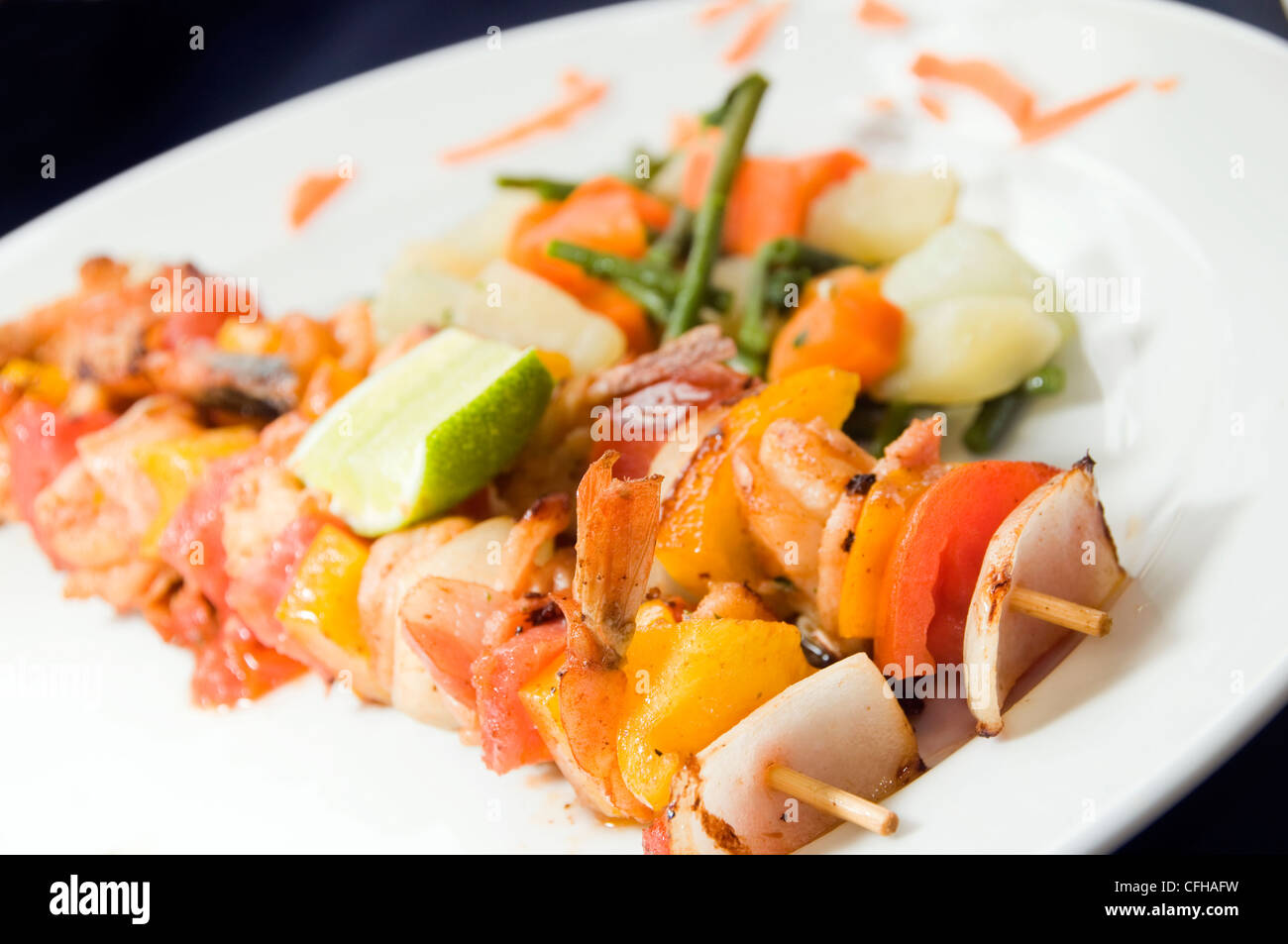 shrimp kabob on skewer fresh vegetables Latin style as photographed in ...