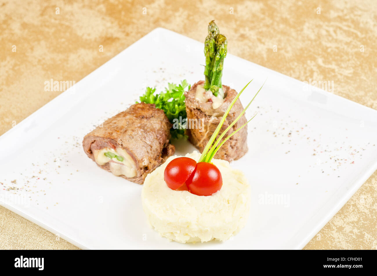 Grilled meat rolls from beef meat with mozzarella, ham, asparagus and ...