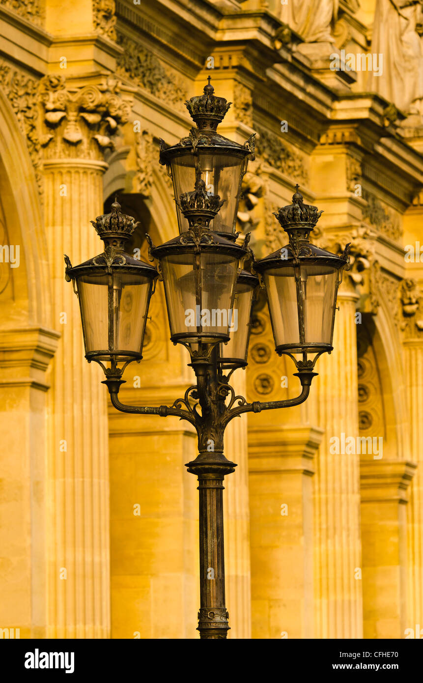 Lamp posts and columns at the Louvre Palace, Louvre Museum, Paris ...