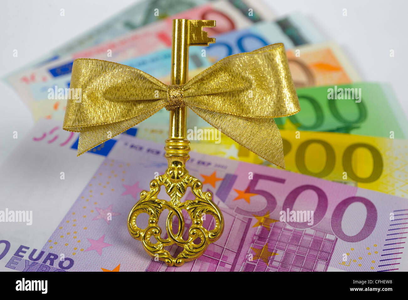 golden key and euro Stock Photo - Alamy