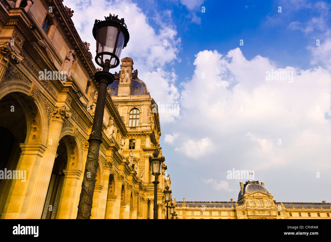 Lamp posts and courtyard at the Louvre Palace, Louvre Museum, Paris ...