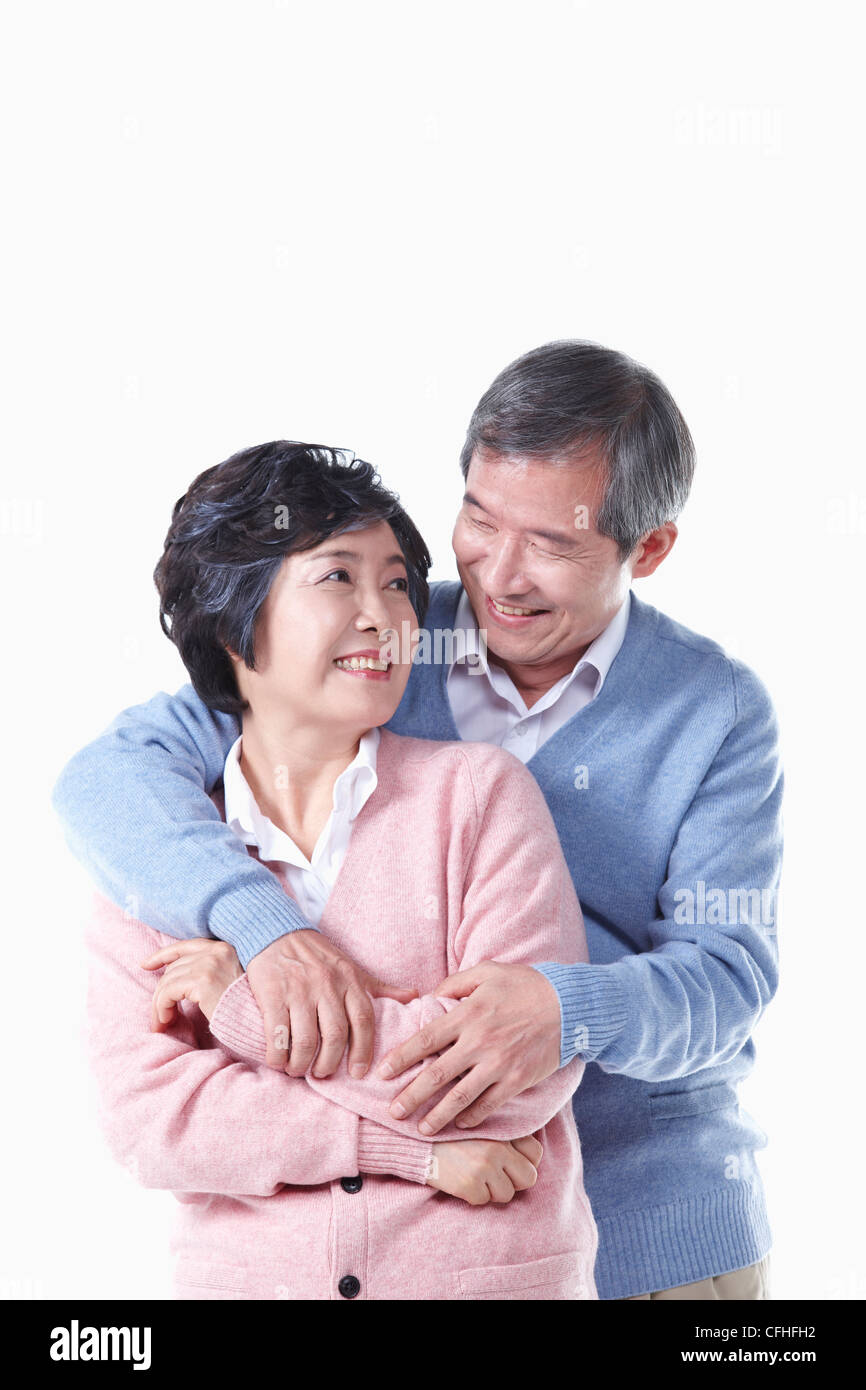 The hugging elderly man and woman Stock Photo - Alamy