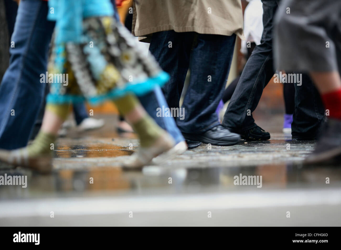 Feet and legs of people walking through London in a busy shopping ...