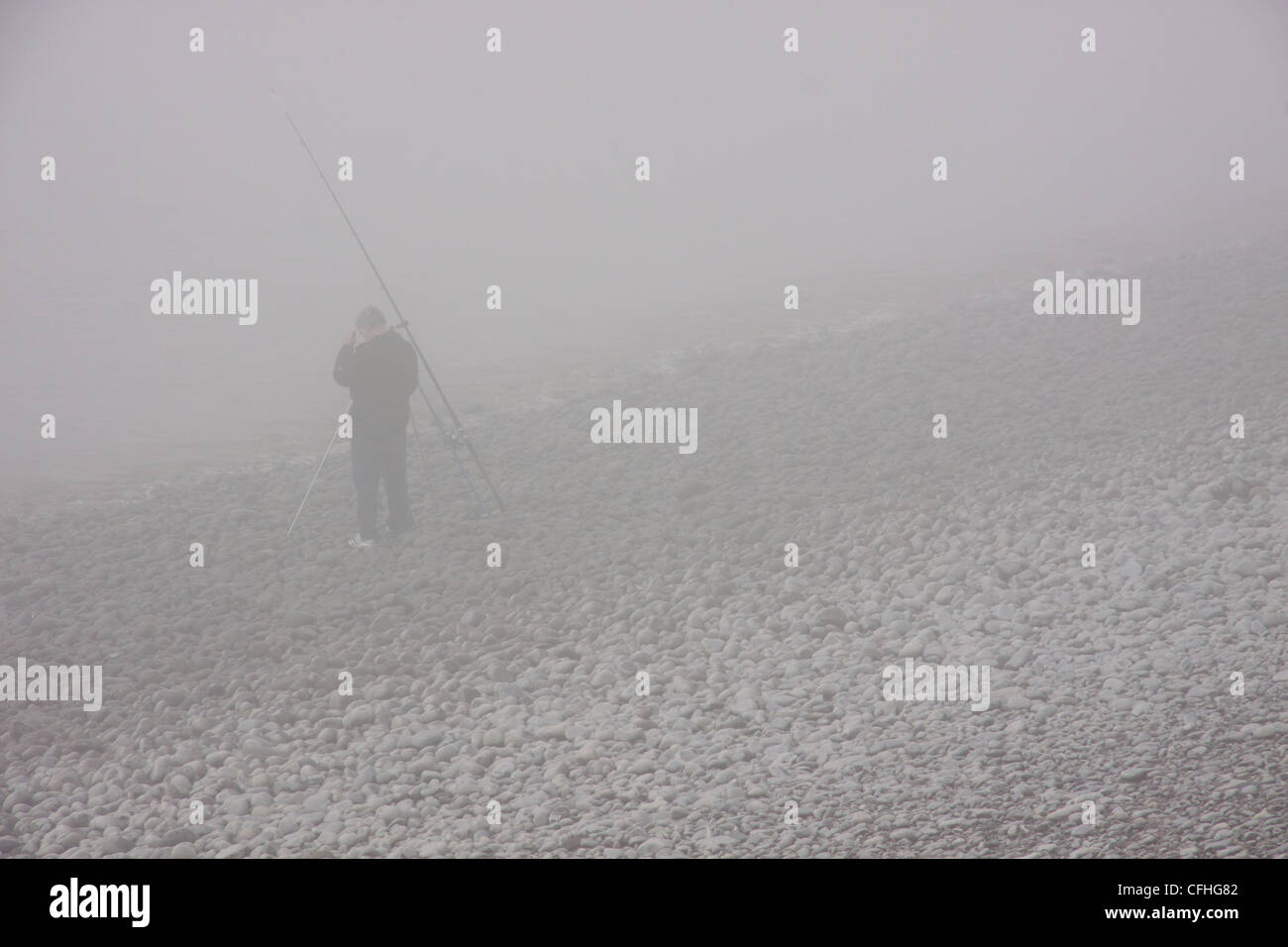fisherman in the fog,fishing in sea fog,sea mist Stock Photo - Alamy