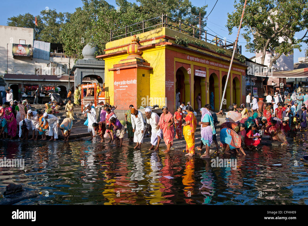 Hindu pilgrims making the ritual ablutions. Ram Kund. Godavari river ...