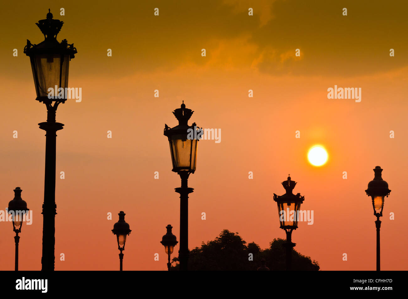 Lamp posts at sunset, Louvre Museum, Paris, France Stock Photo - Alamy