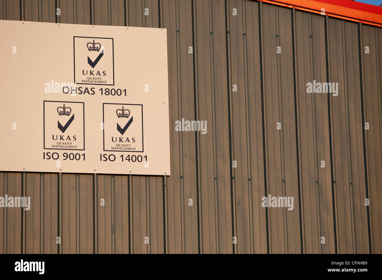 Sign on industrial premises showing UK accredited quality control ...