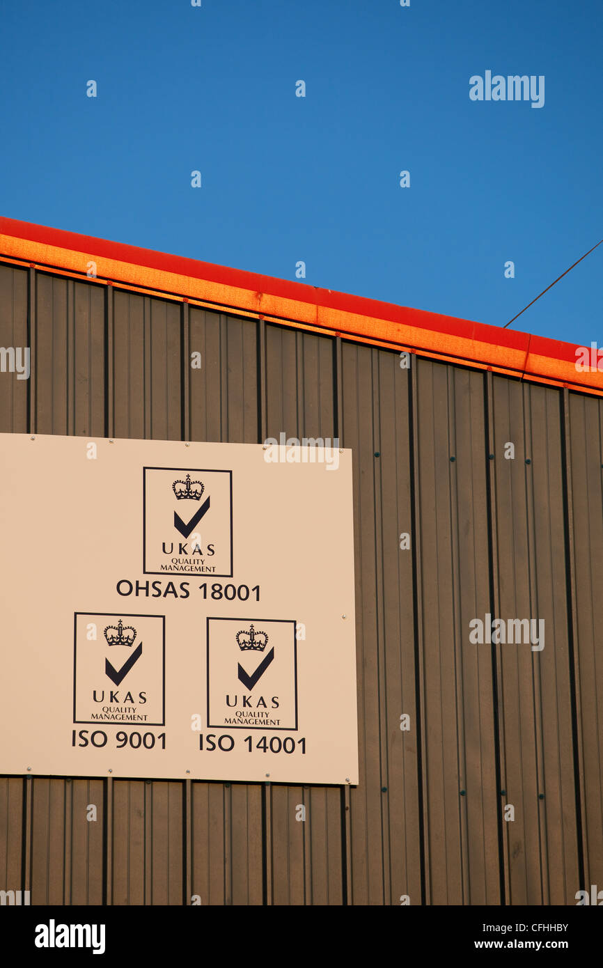 Sign on industrial premises showing UK accredited quality control ...