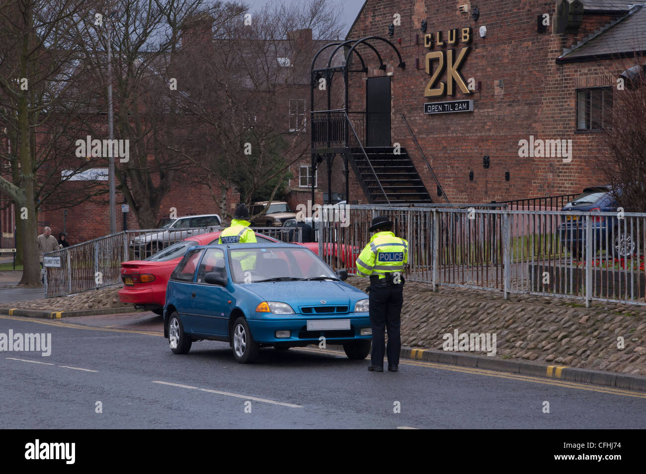 Double yellow - police officers in yellow jackets issue a parking ...
