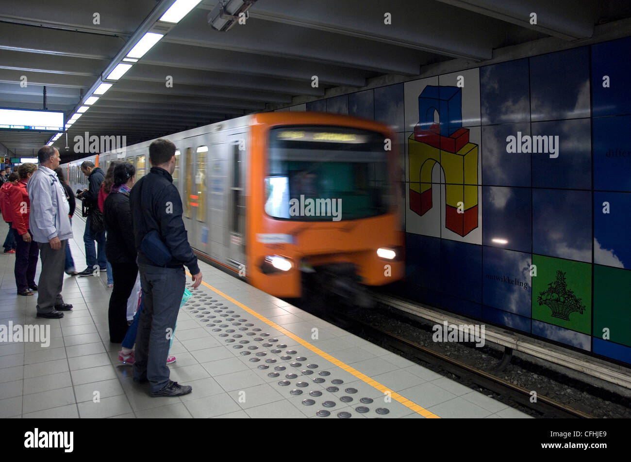Horizontal wide angle view of a train (with motion blur) arriving at a ...