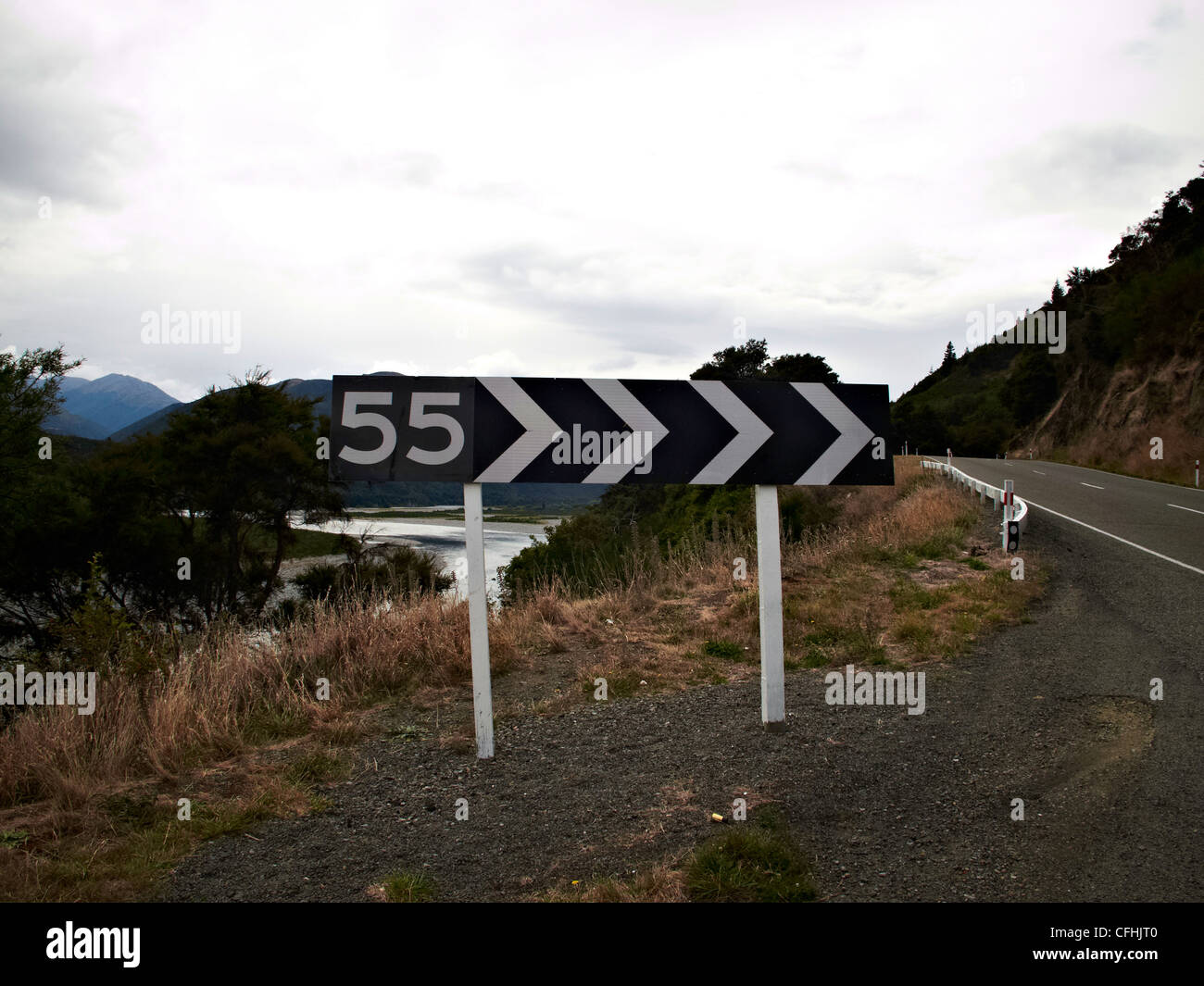 55 speed sign with corner chevrons on a road side Stock Photo - Alamy