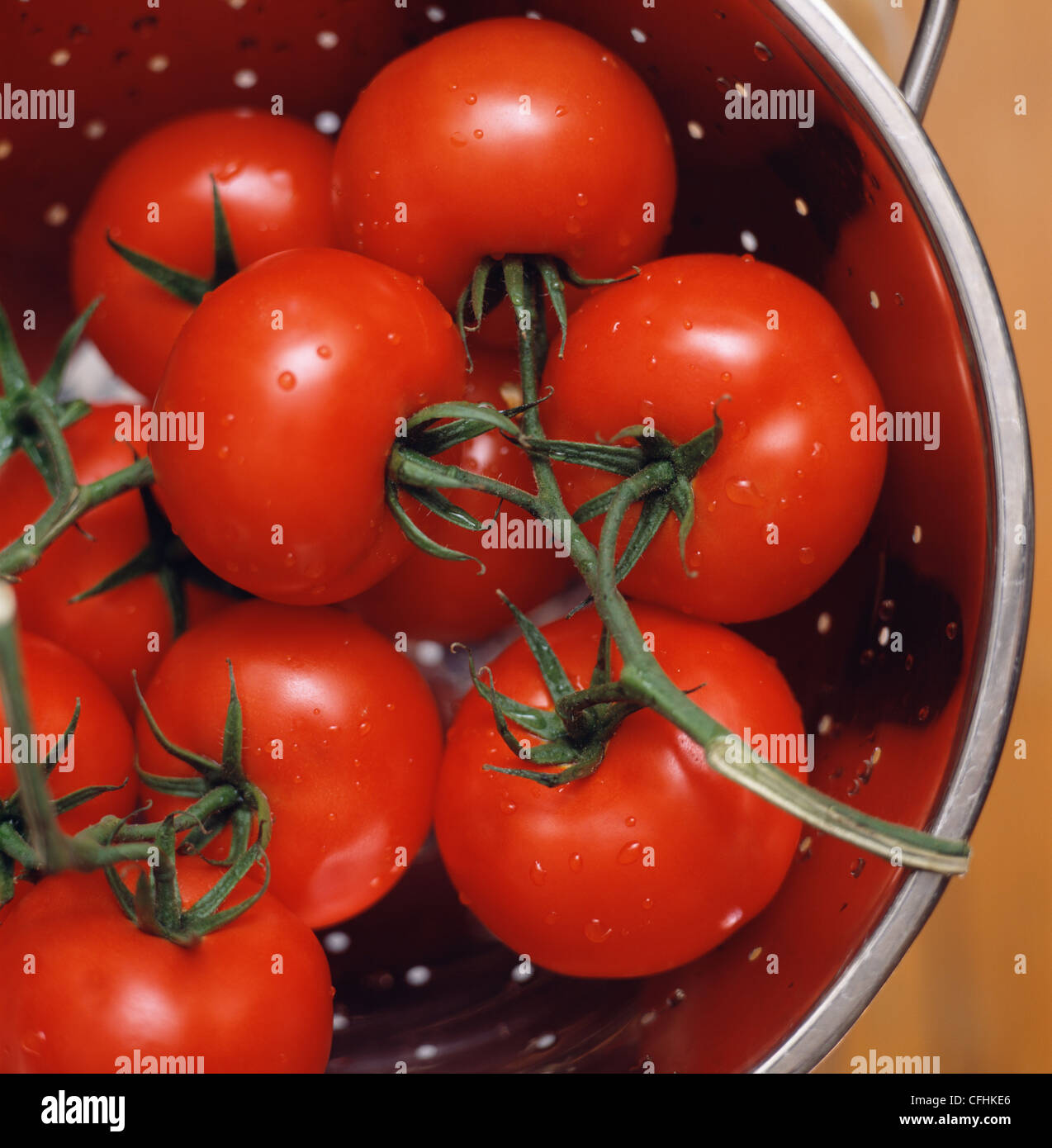 Freshly washed vine ripened tomatoes Stock Photo - Alamy