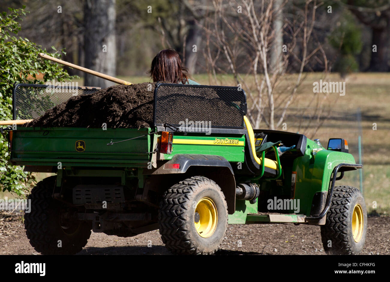 Female gardener with a load of mulch Stock Photo - Alamy