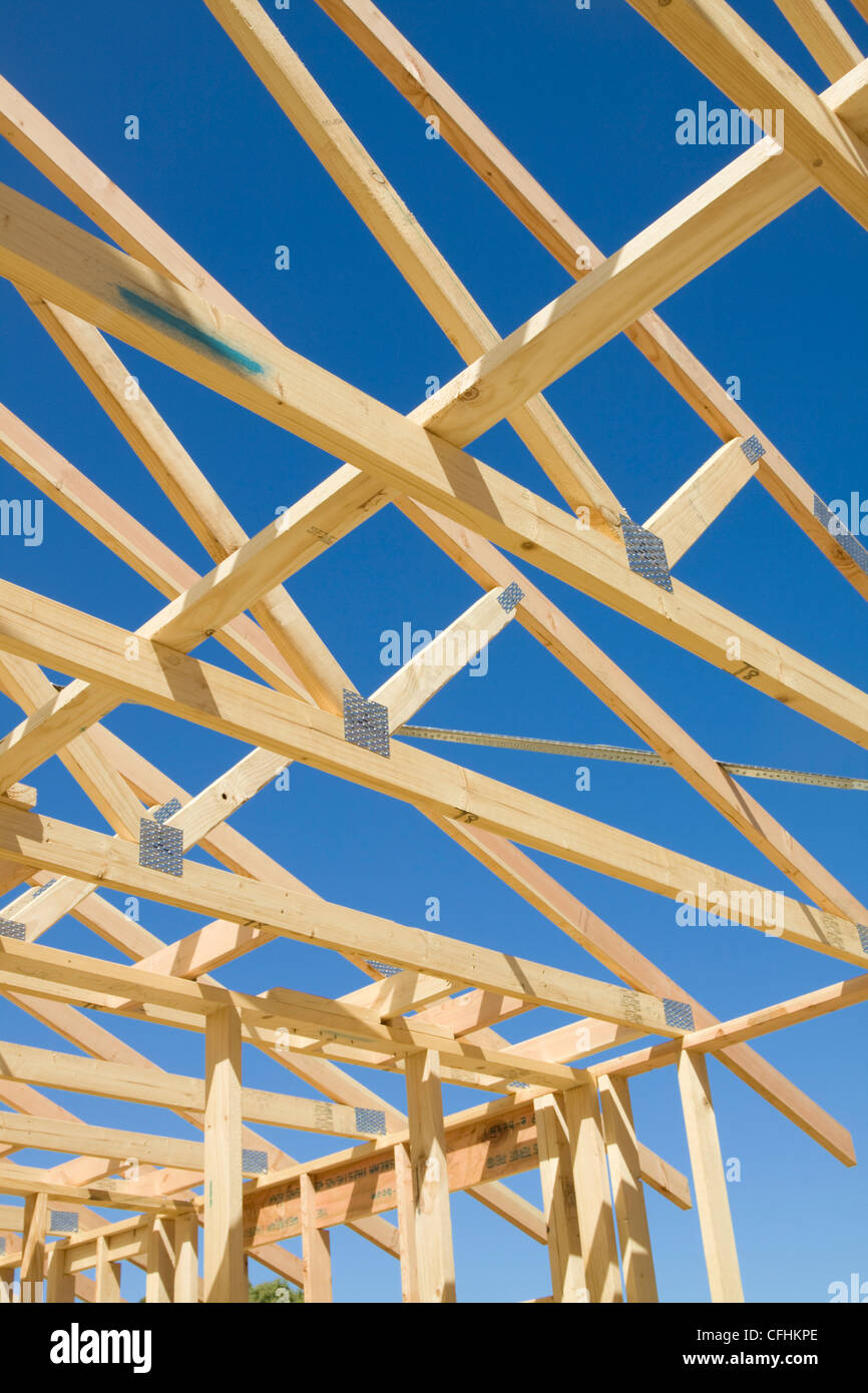 Skeleton timber wood planks used for building the roof of a house ...