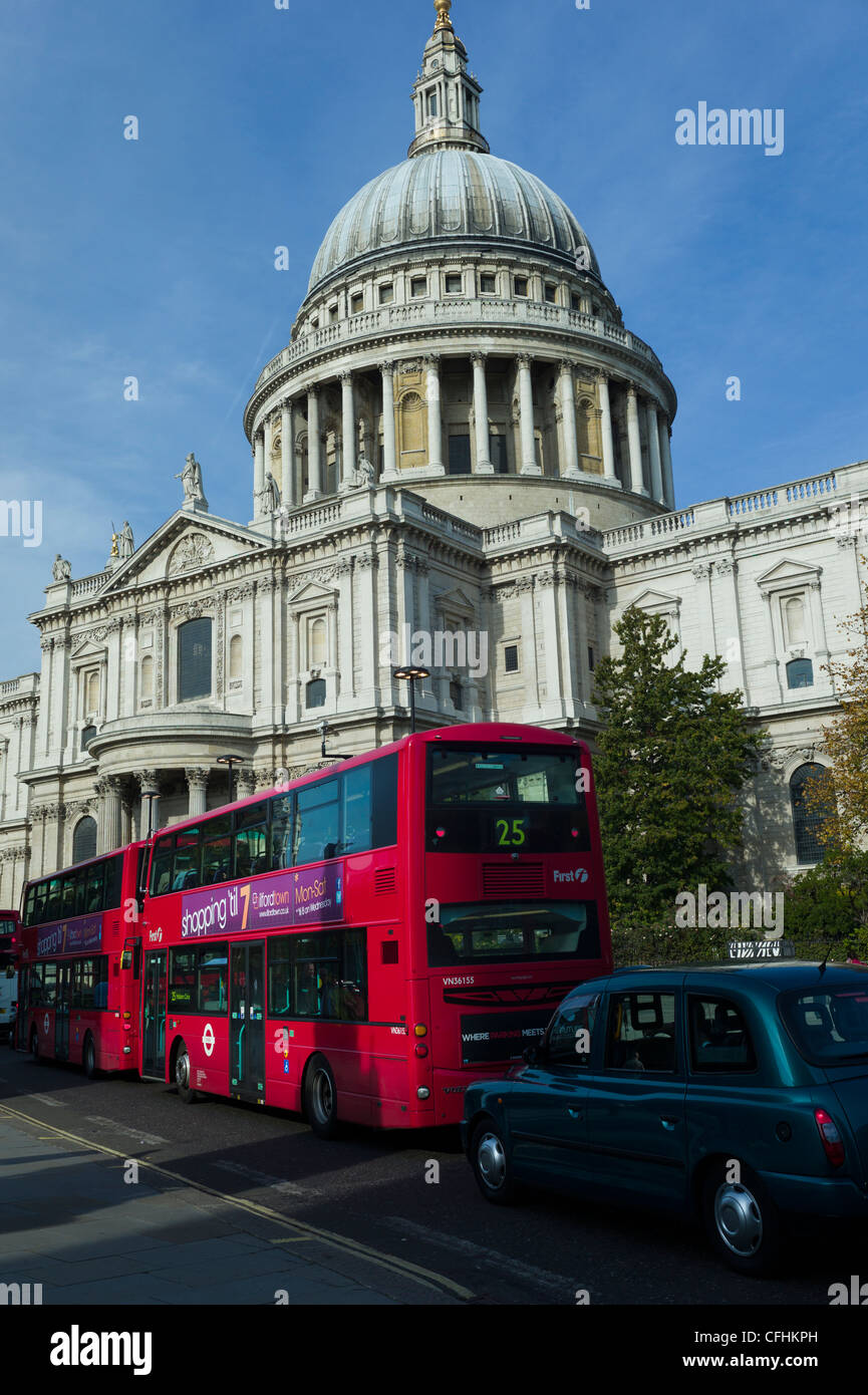 London red buses and a black cab, taxi in front of St Paul's Cathedral ...