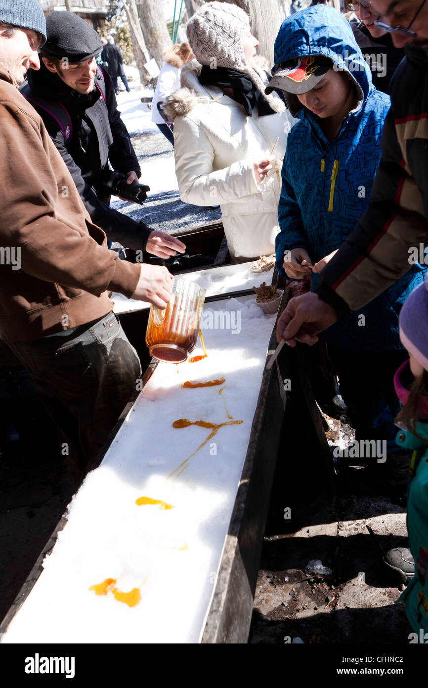 Maple syrup on snow,maple taffy,maple syrup Quebec Stock Photo - Alamy