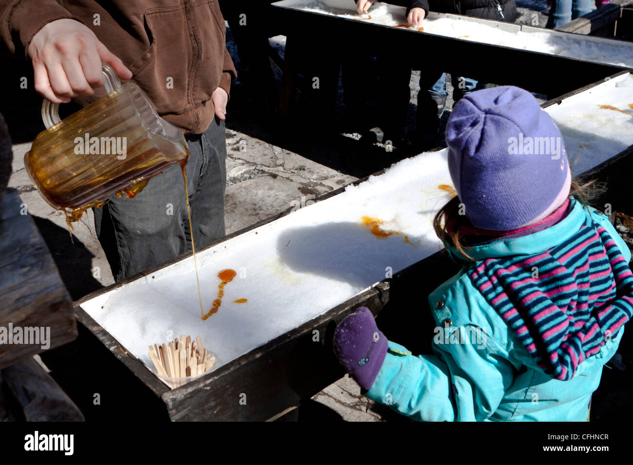 Maple syrup on snow,maple taffy,maple syrup Quebec Stock Photo - Alamy