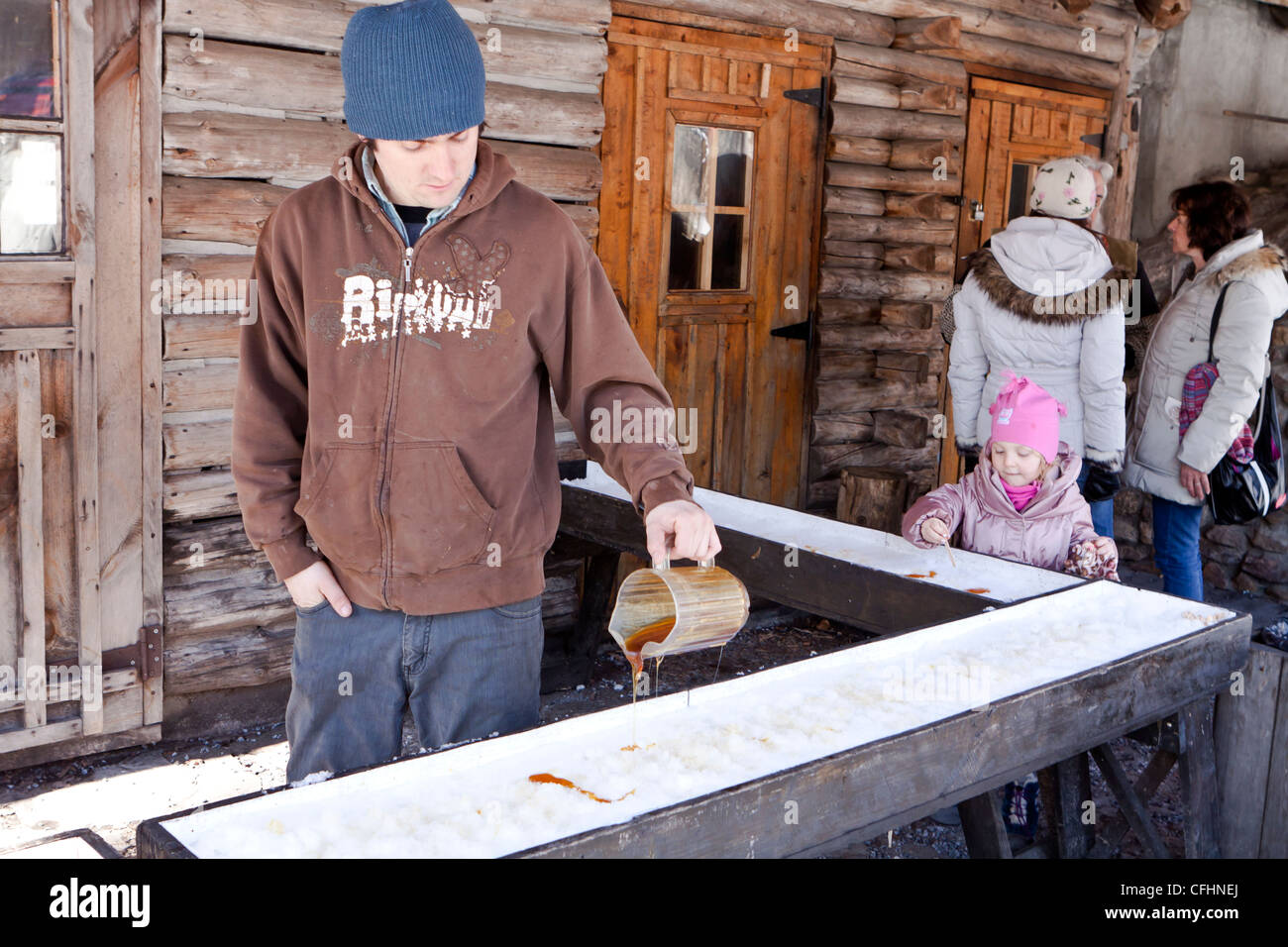 Maple syrup on snow,maple taffy,maple syrup Quebec Stock Photo - Alamy