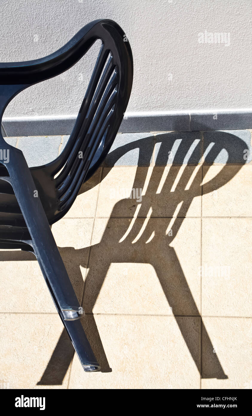 Chair casting shadow hi-res stock photography and images - Alamy