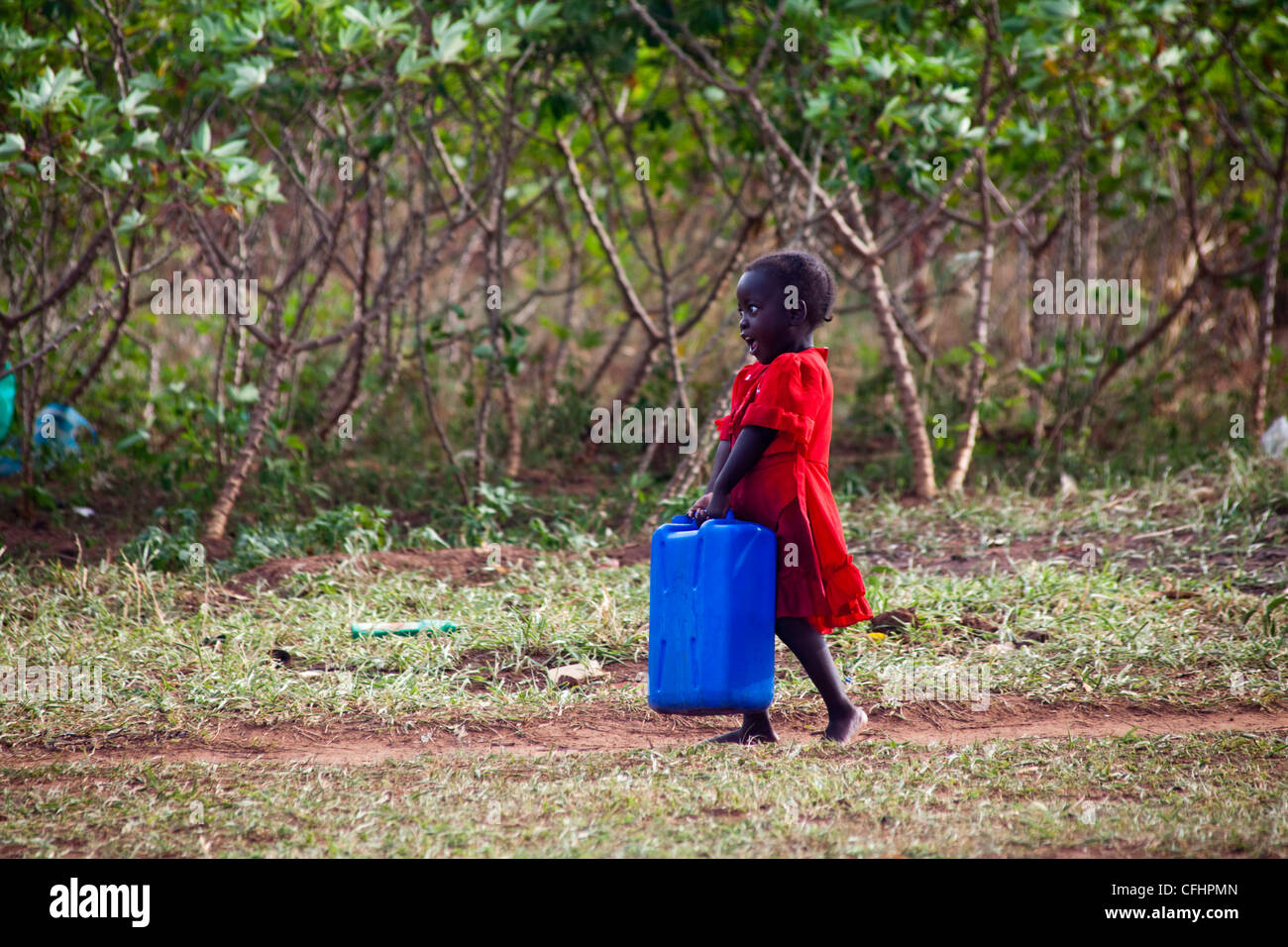 Child fetching water hi-res stock photography and images - Alamy