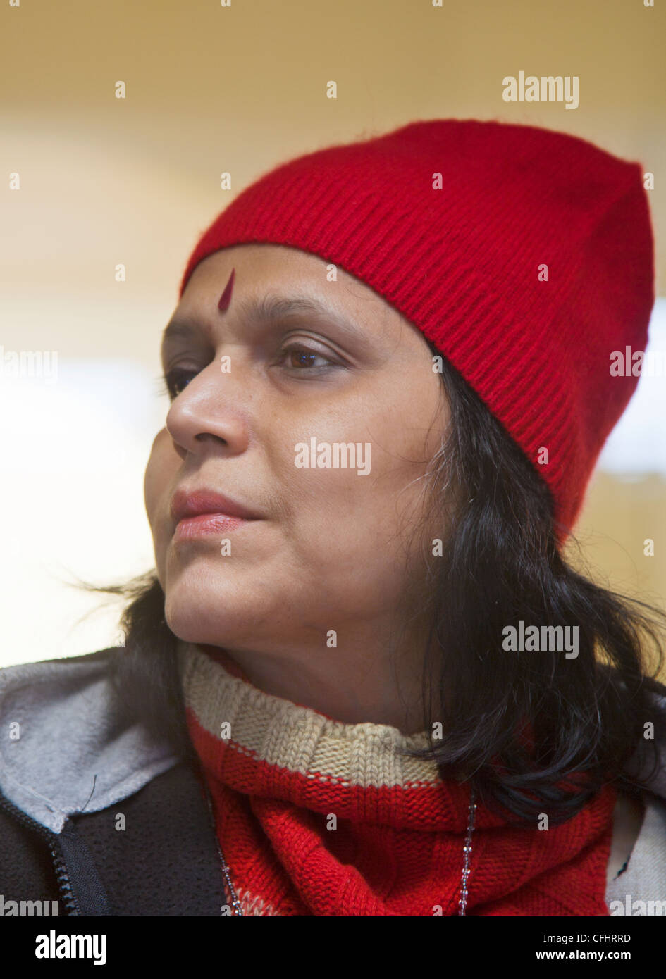 Portrait of pretty Indian lady, straight face slight smile relaxing ...