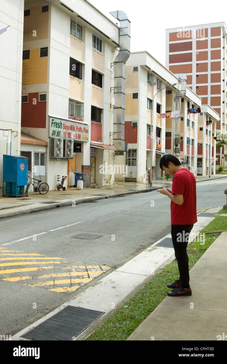 Pedestrian using a smart phone. Singapore Stock Photo - Alamy