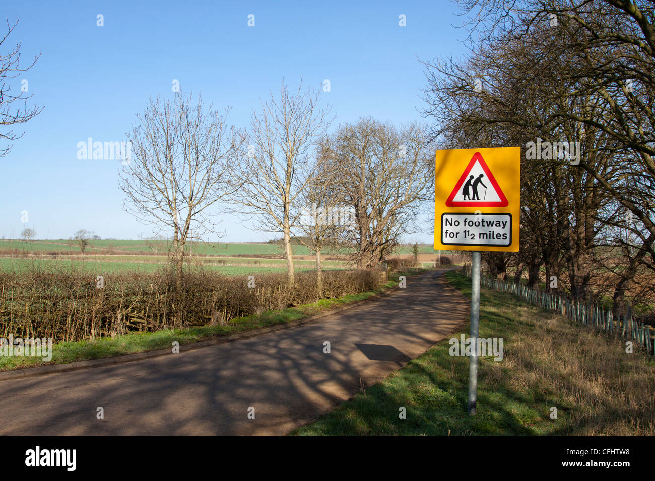English countryside road with a no path warning sign. The sign reads no ...