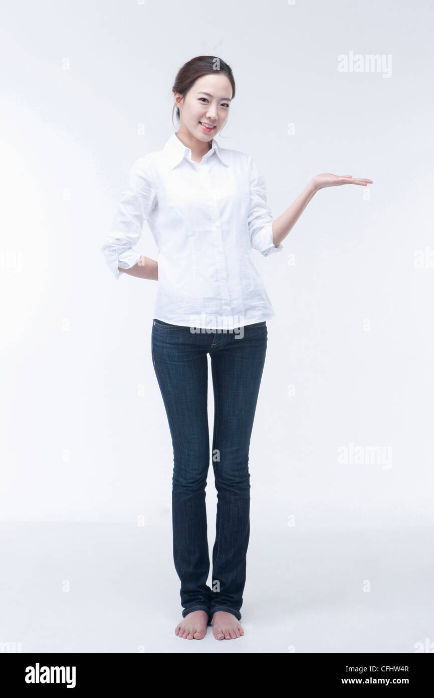 The woman presenting with one hand Stock Photo - Alamy