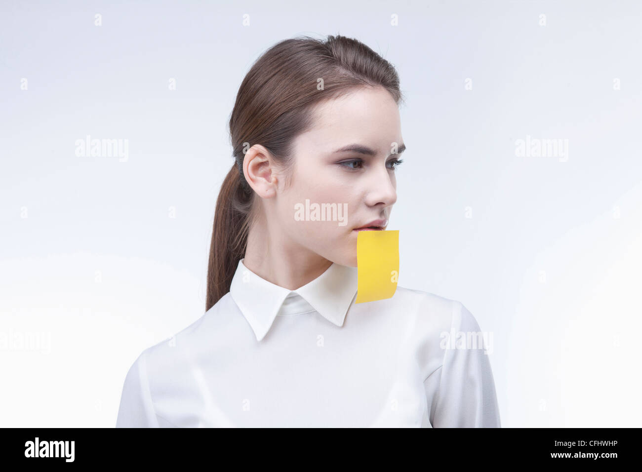 The woman having the sticky note below her lips Stock Photo - Alamy
