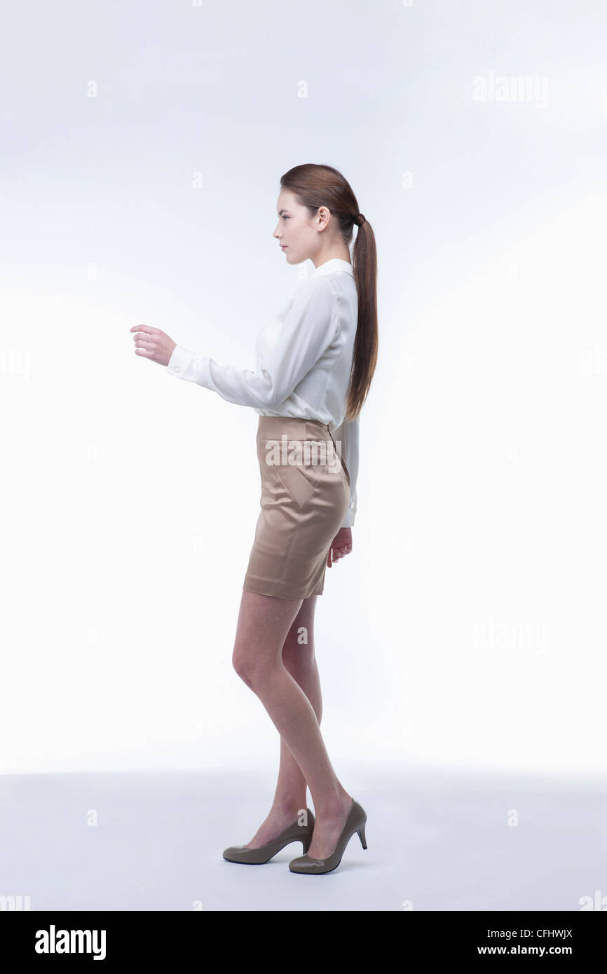 The standing woman from the side Stock Photo - Alamy