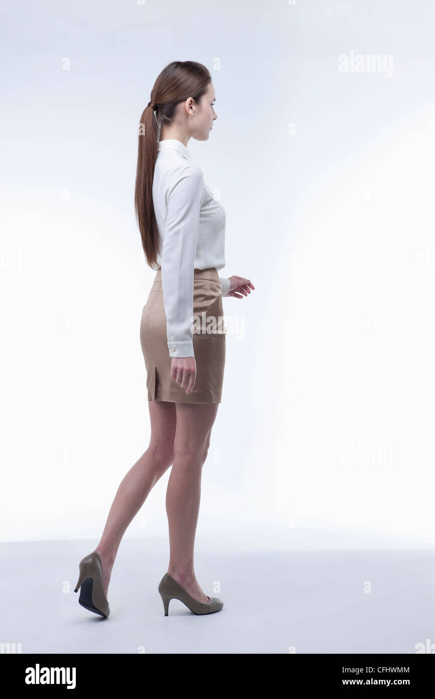 The standing woman from the side Stock Photo - Alamy