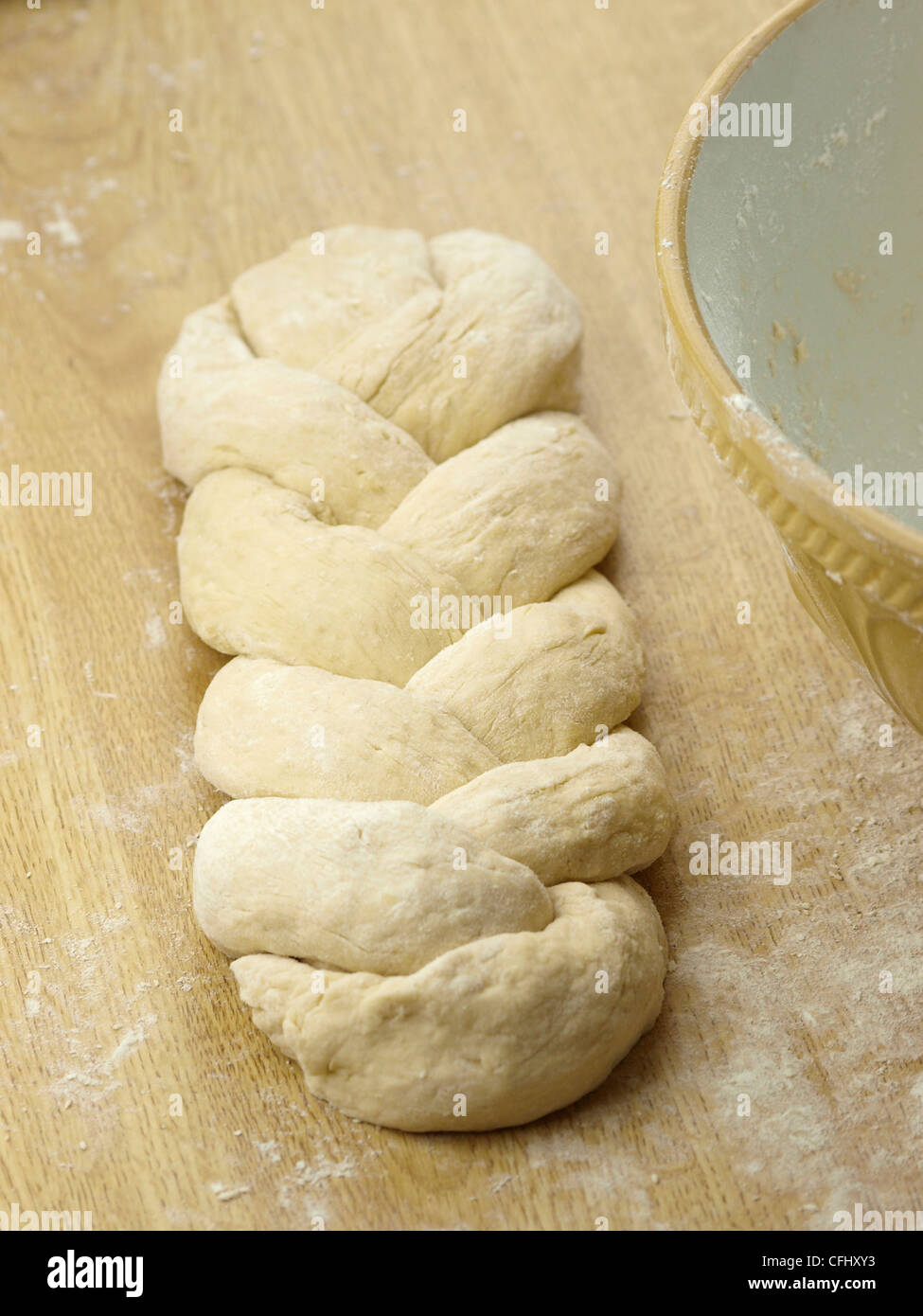 Making a plaited loaf of bread Stock Photo - Alamy