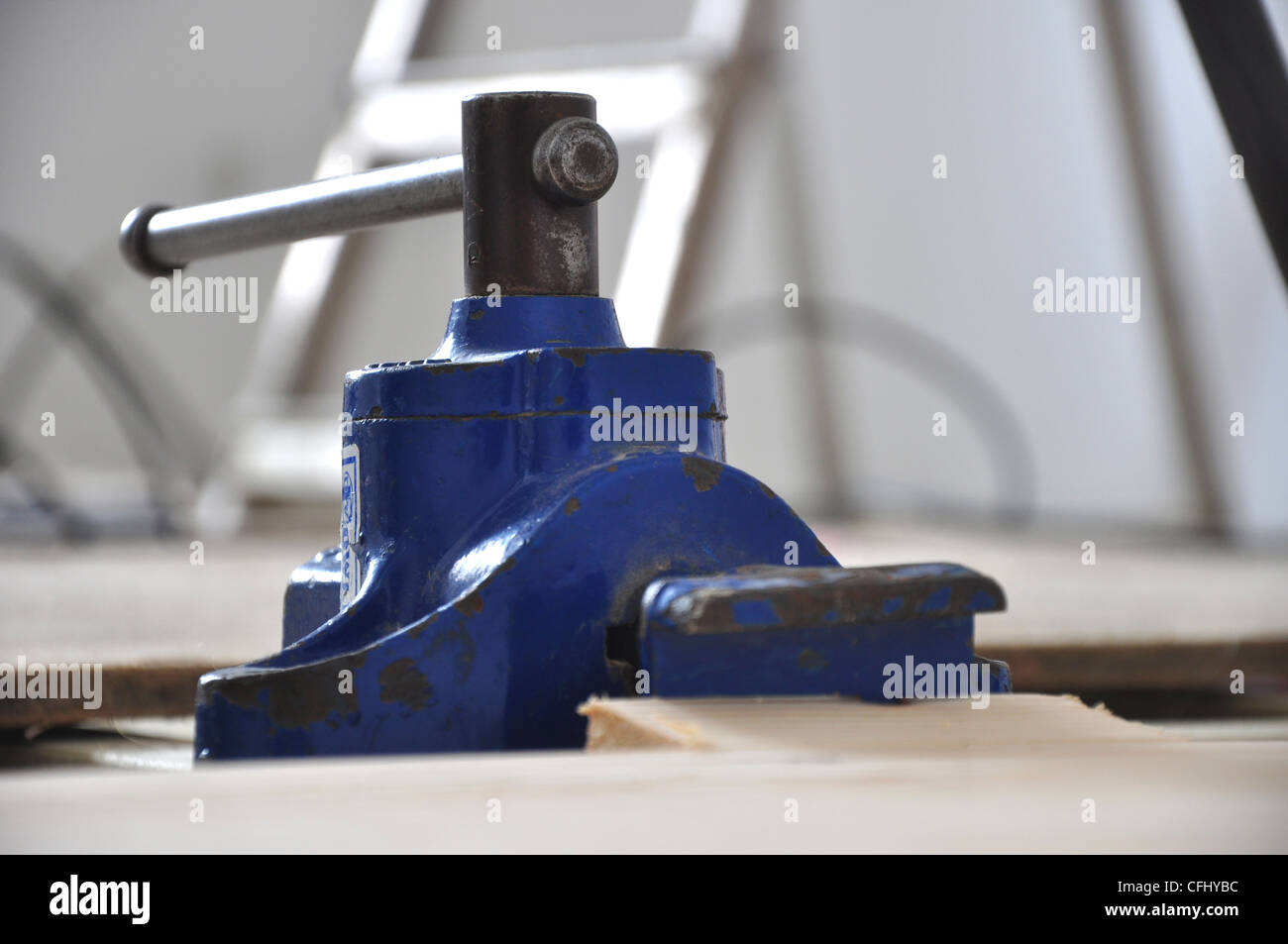 A floor cramp in use on tongue and groove floorboards UK Stock Photo ...