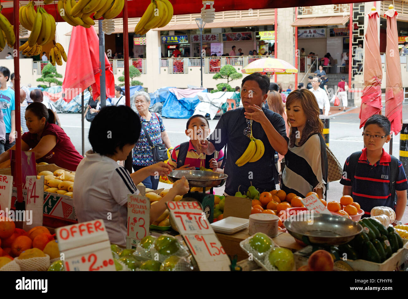 Shoppers buying fruits in Bugis Junction market, Singapore Stock Photo ...