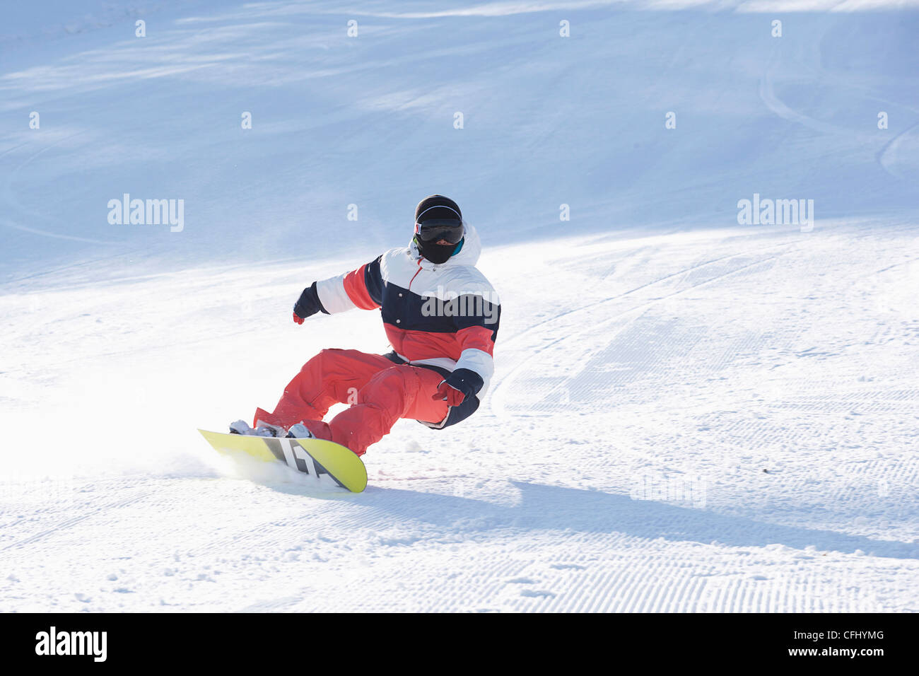 A man snowboarding on the slope Stock Photo - Alamy