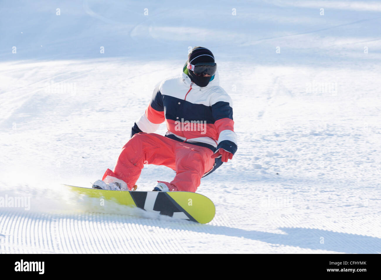A man snowboarding on the slope Stock Photo - Alamy
