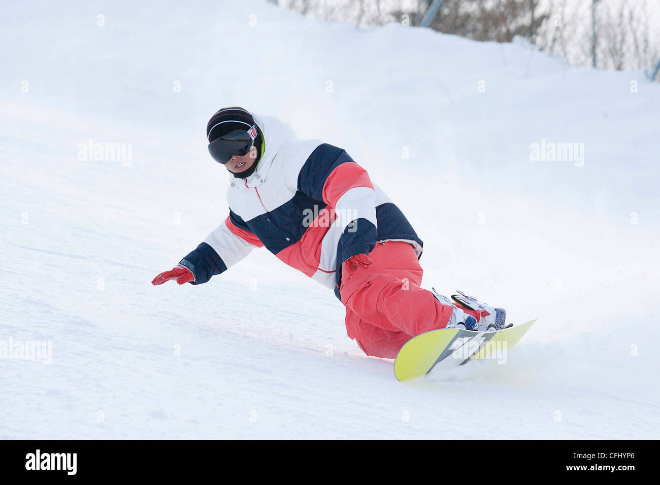 A man snowboarding on the slope Stock Photo - Alamy