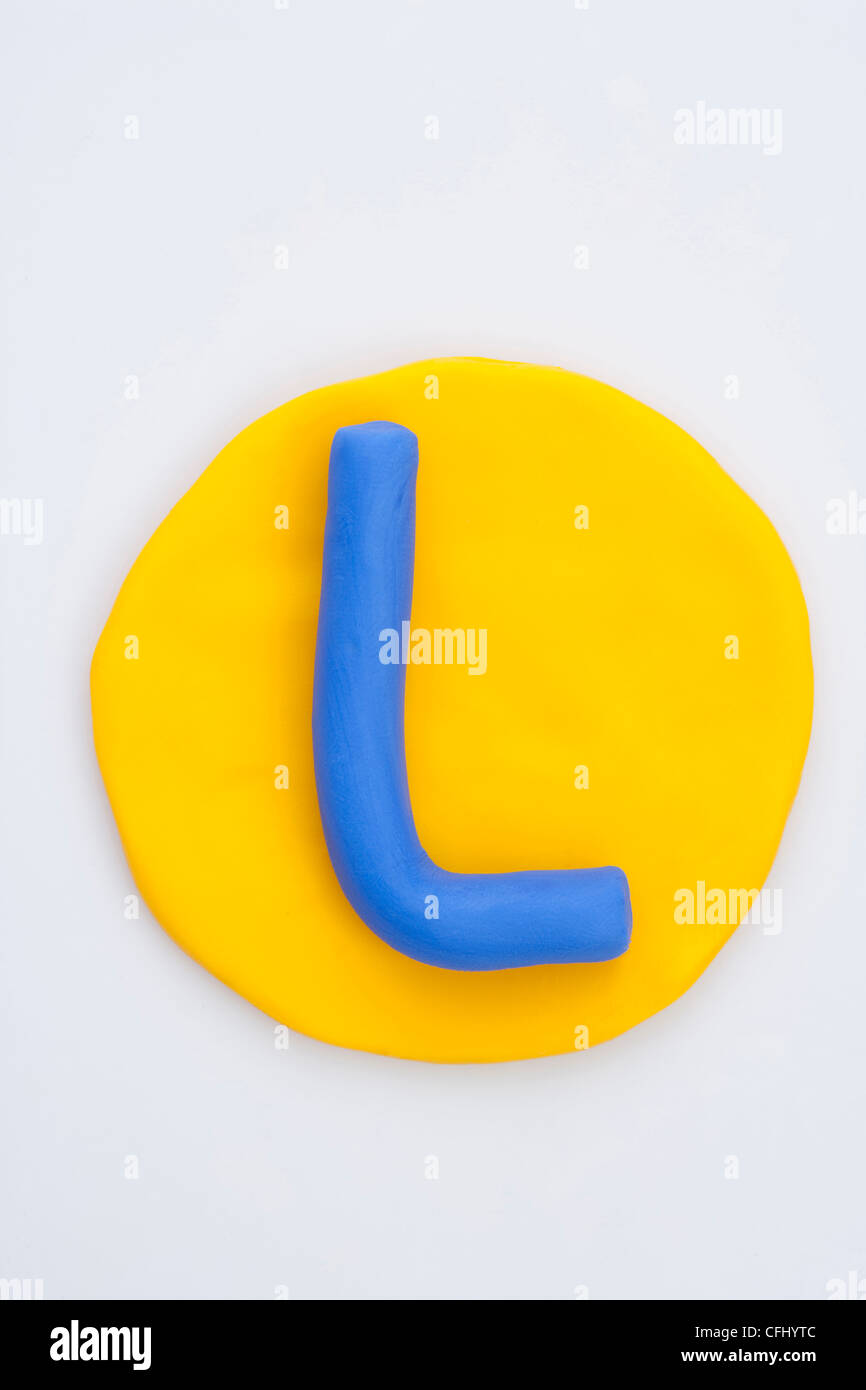 The alphabet L shaped blue clay on the yellow circle clay Stock Photo ...