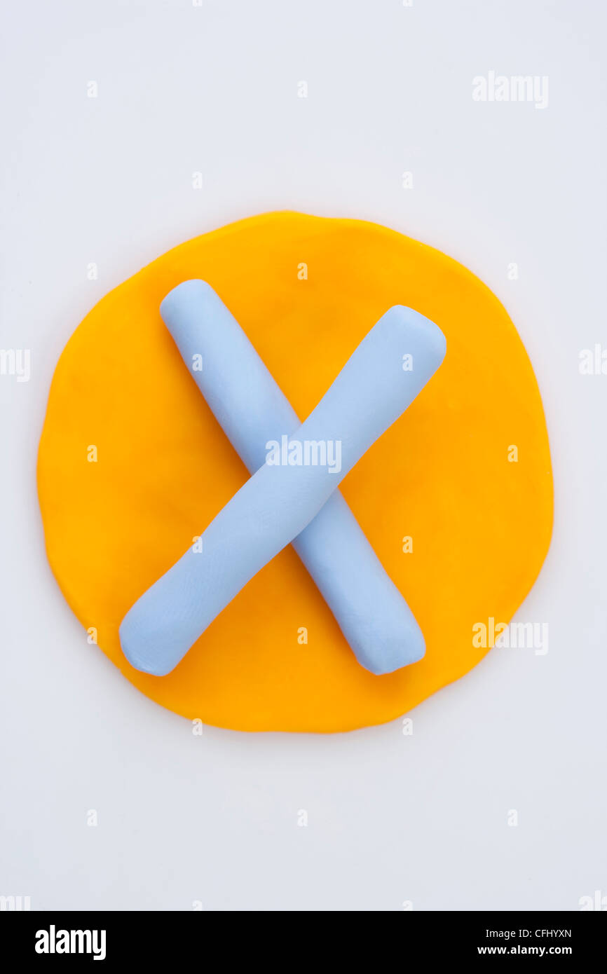 The alphabet X shaped blue clay on the yellow circle clay Stock Photo ...